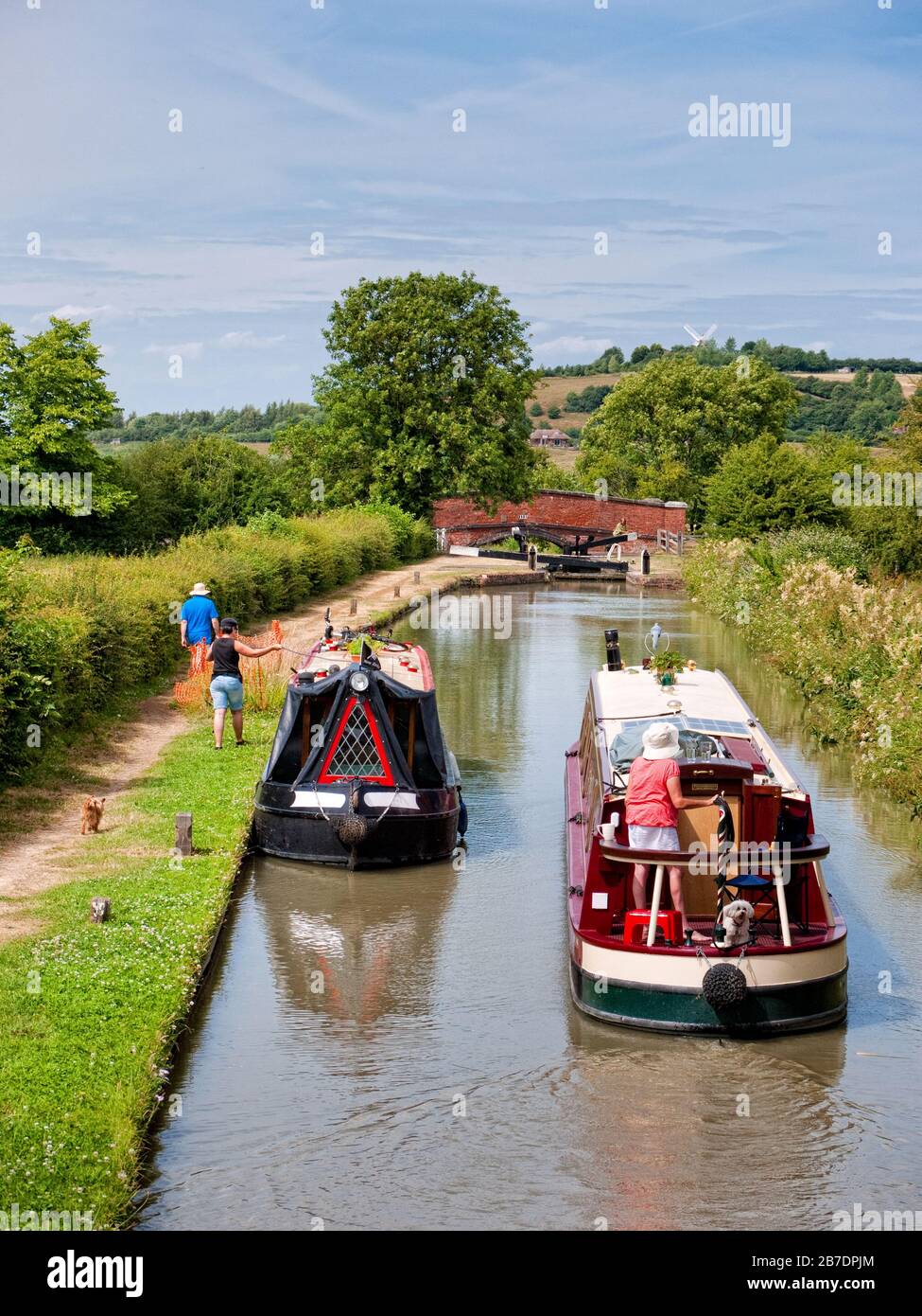 Narrowboats passing each other on approaching a lock on the Napton ...