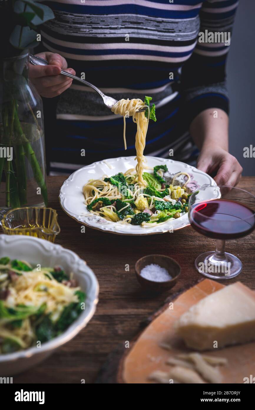 Woman eating spaghetti hi-res stock photography and images - Alamy