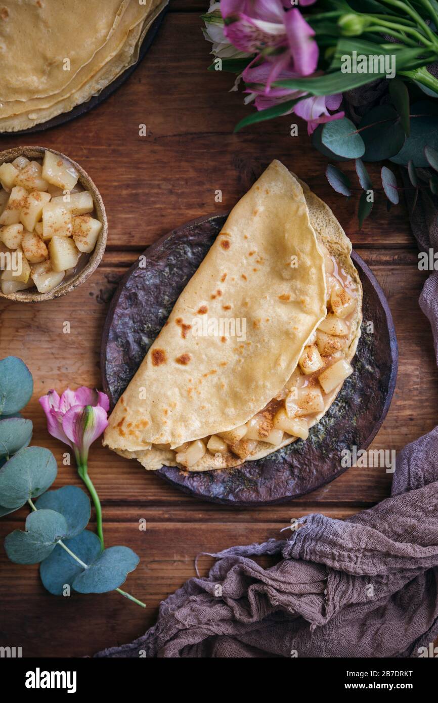 Crêpe filled with sauteed cinnamon and maple syrup apples Stock Photo ...