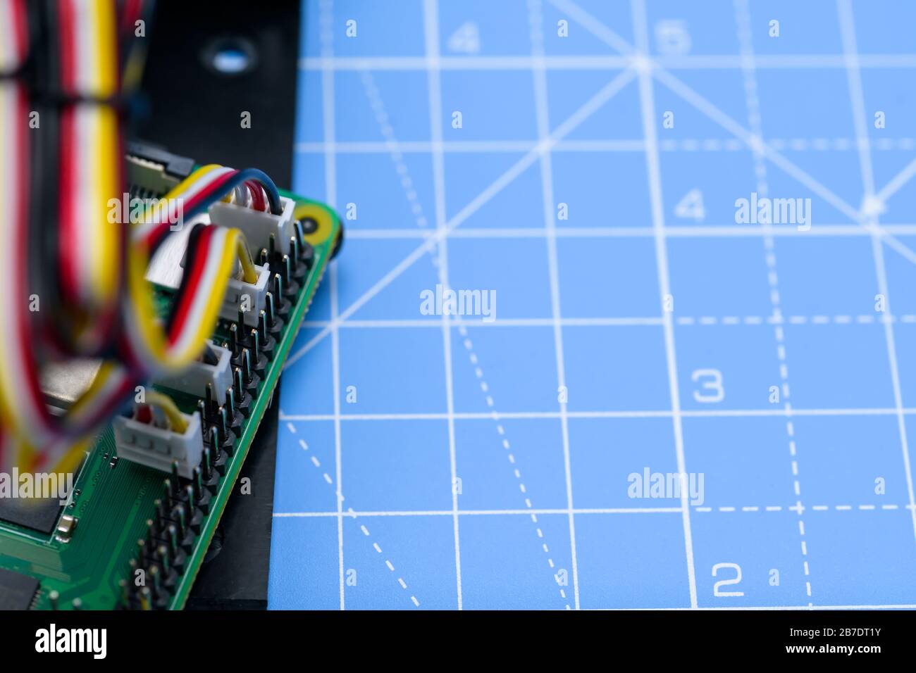 Circuit board with cables connected on a blue background with numbers ...
