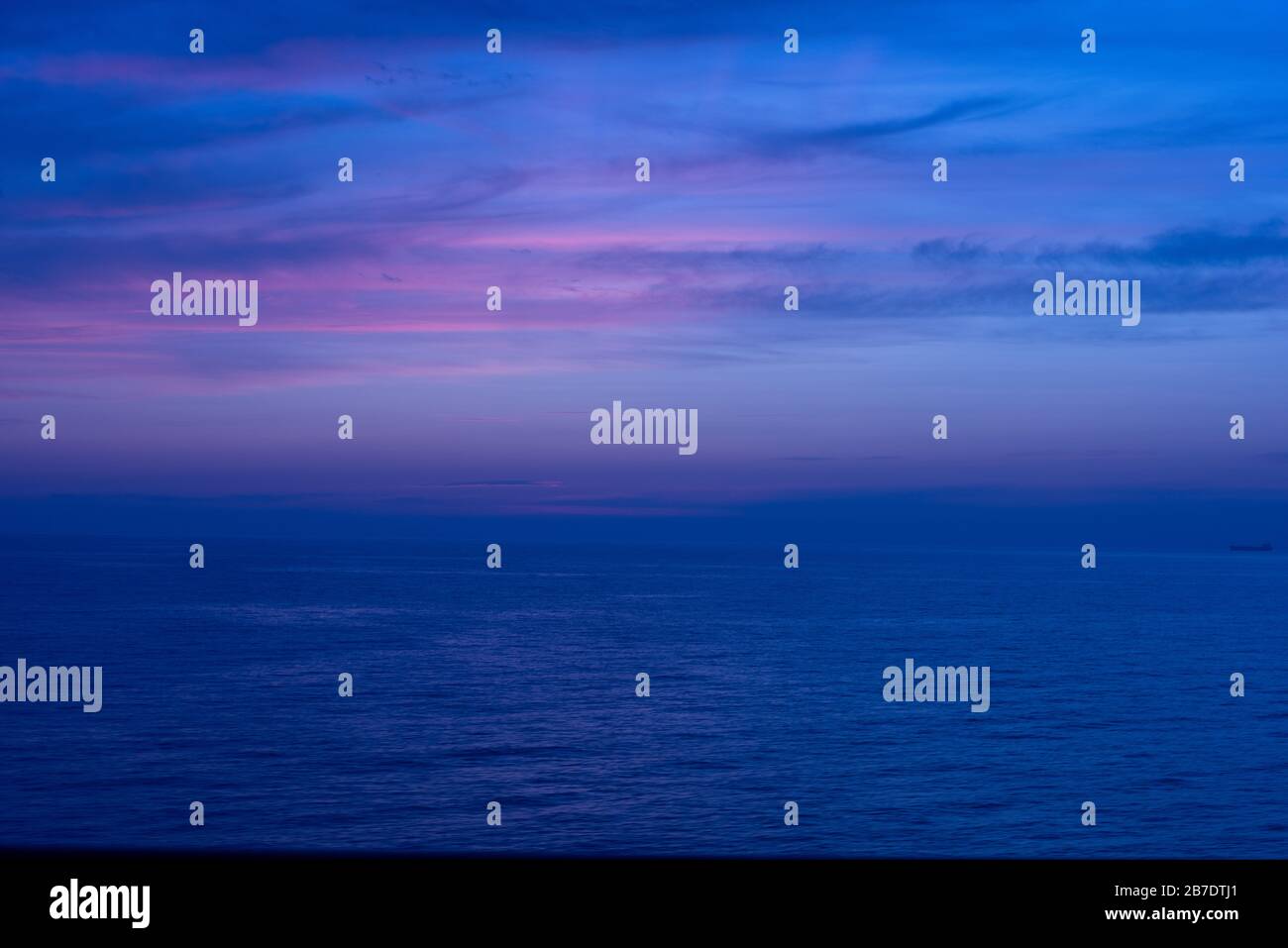 blue hour on a cruise ship after the sun has set on the horizon of the ...