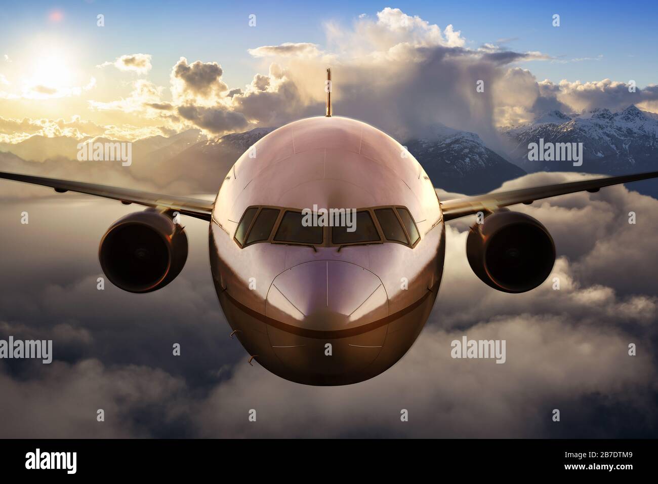 Airplane flying above the clouds during colorful sunset or sunrise ...