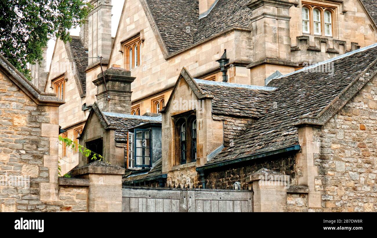 Yellow sandstone building with loft windows and chimneys Stock Photo ...