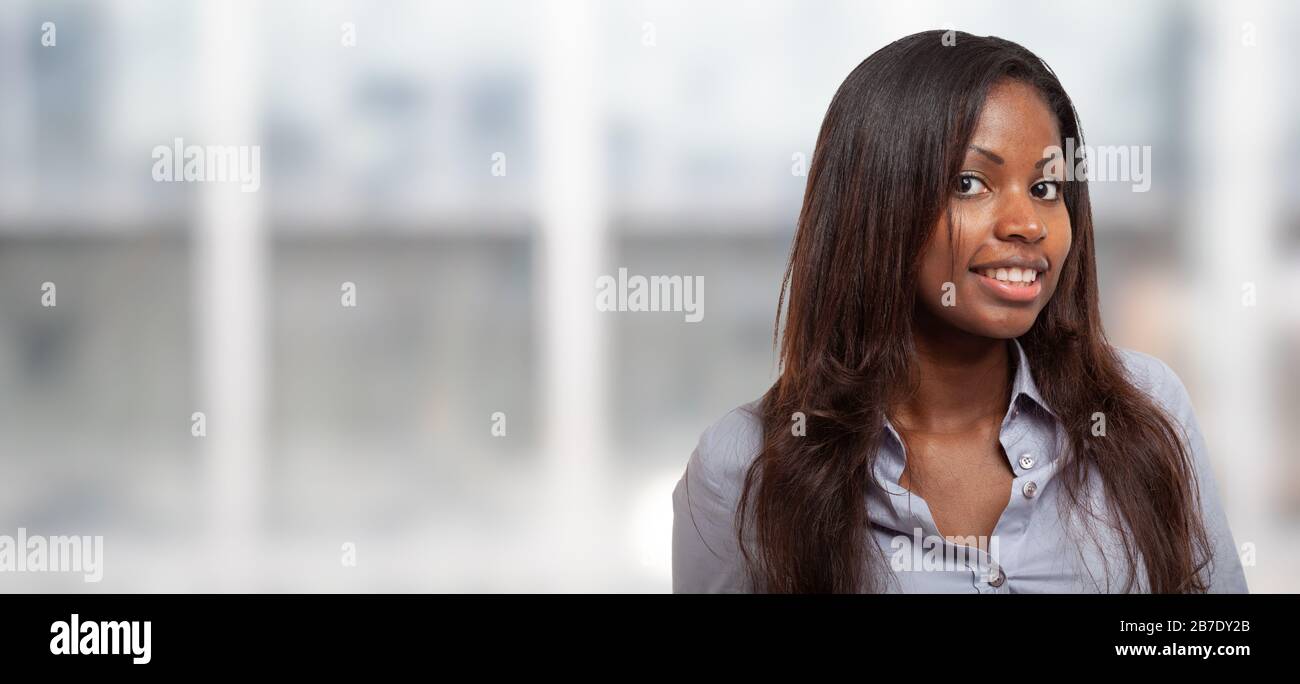 Smiling young black business woman in a bright room Stock Photo - Alamy Smiling young black business woman in a bright room Stock Photo - Alamy