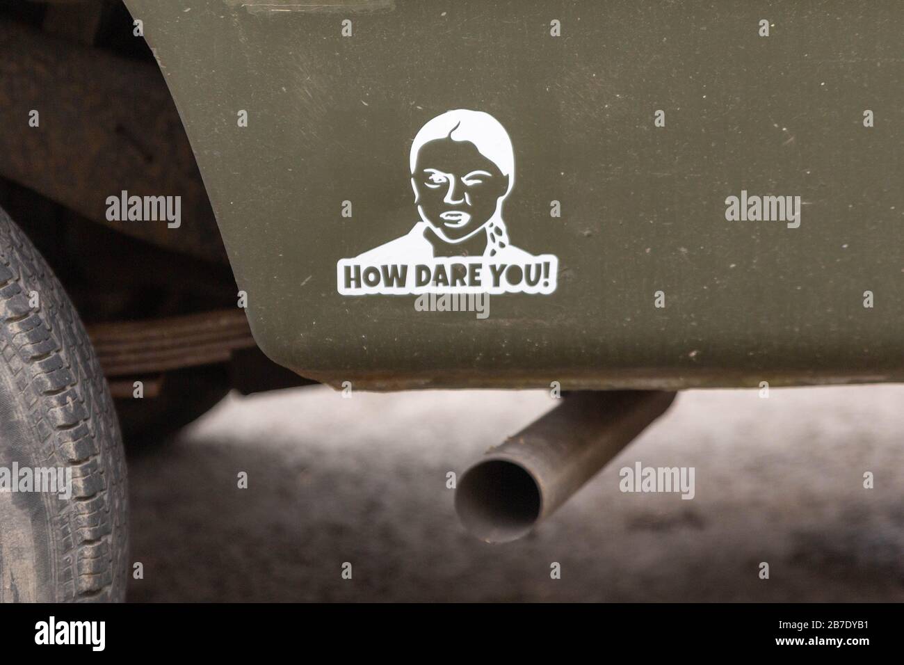 Greta Thunberg’s “HOW DARE YOU!” sticker placed beside a car exhaust ...