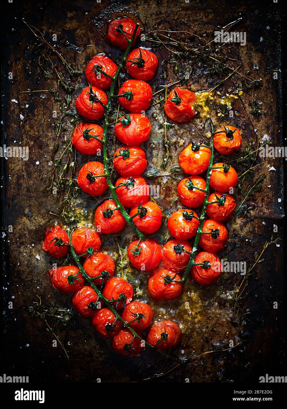 Roasted tomatoes on the vine Stock Photo - Alamy