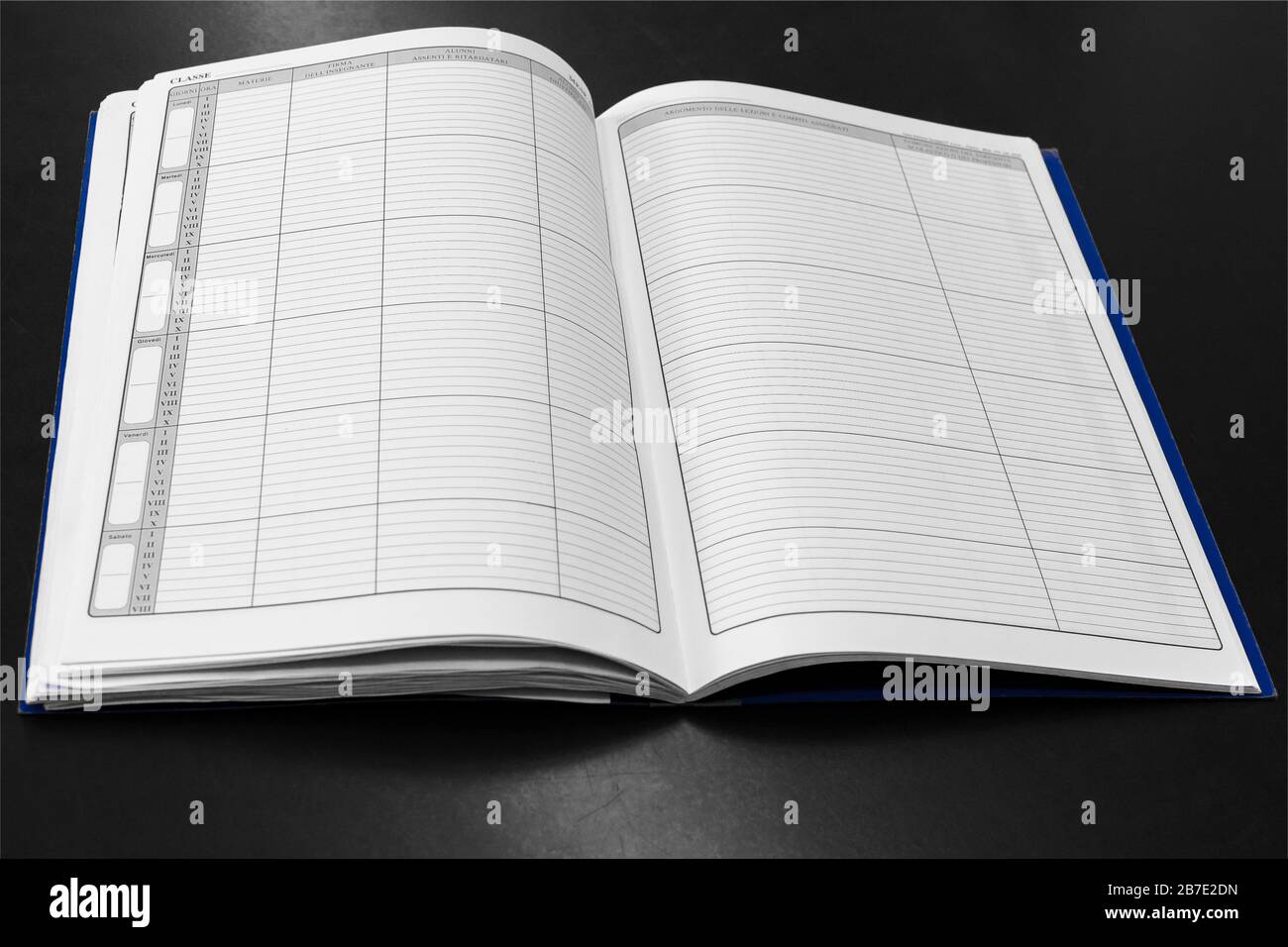 open register on the teacher's desk, inside a classroom of a high ...