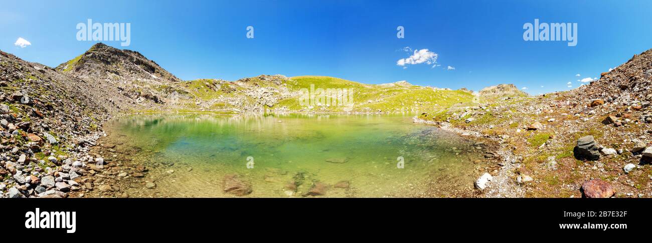 Overview on the alpine lake Stock Photo - Alamy