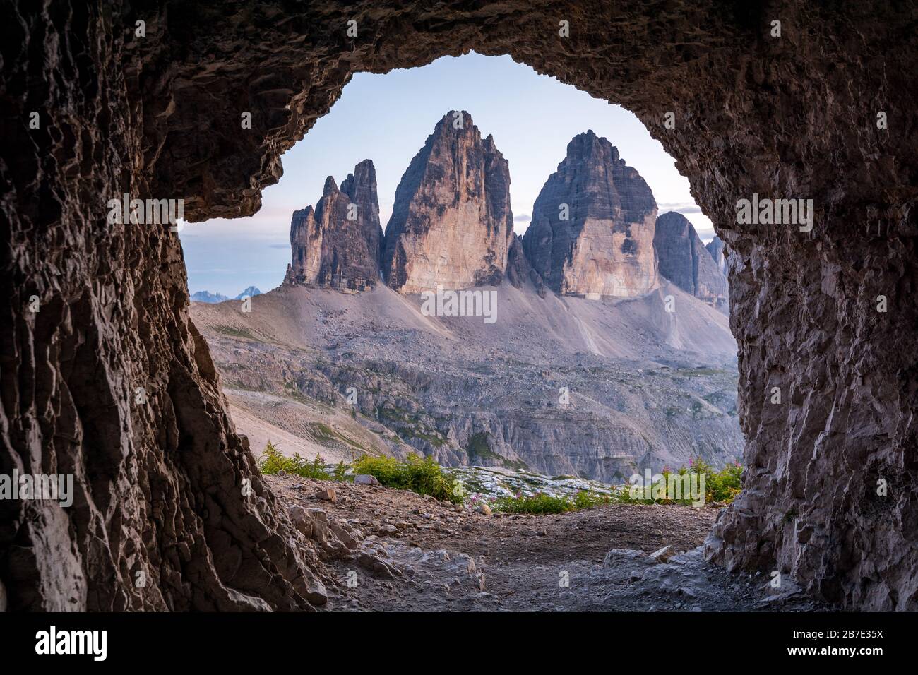 The famous mountains Three Peaks in the Dolomites from a cave during ...