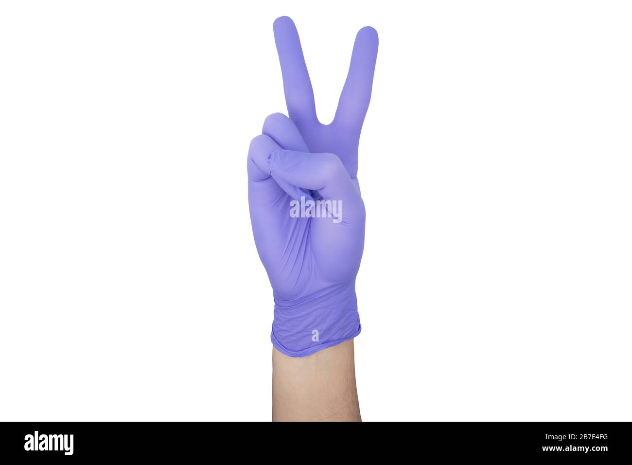 Hand of surgeon with a blue medical glove showing victory sign ...