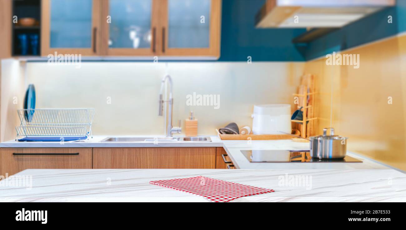 White marble texture table top on blurred kitchen background Stock ...