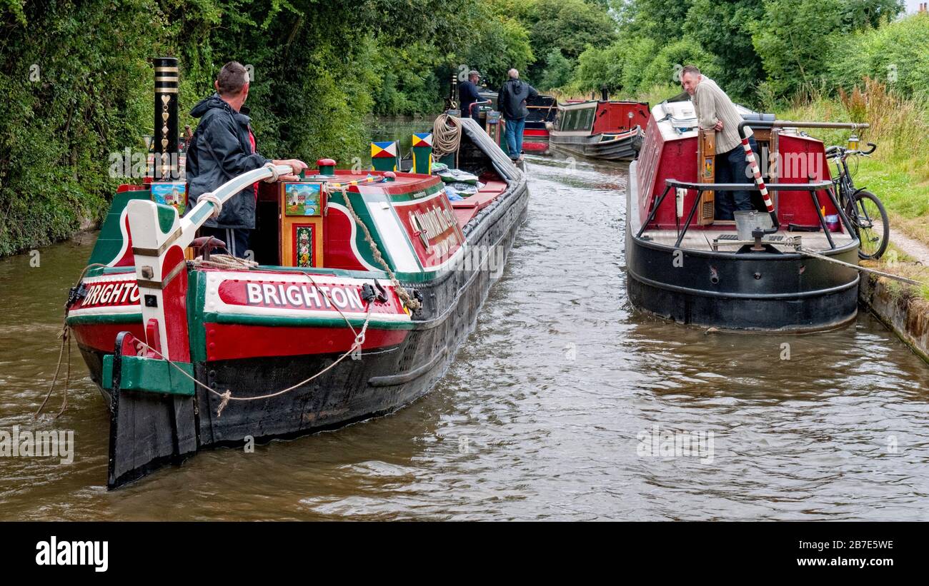 Colourful historic narrowboat cruising the Oxford Canal near Thrupp ...