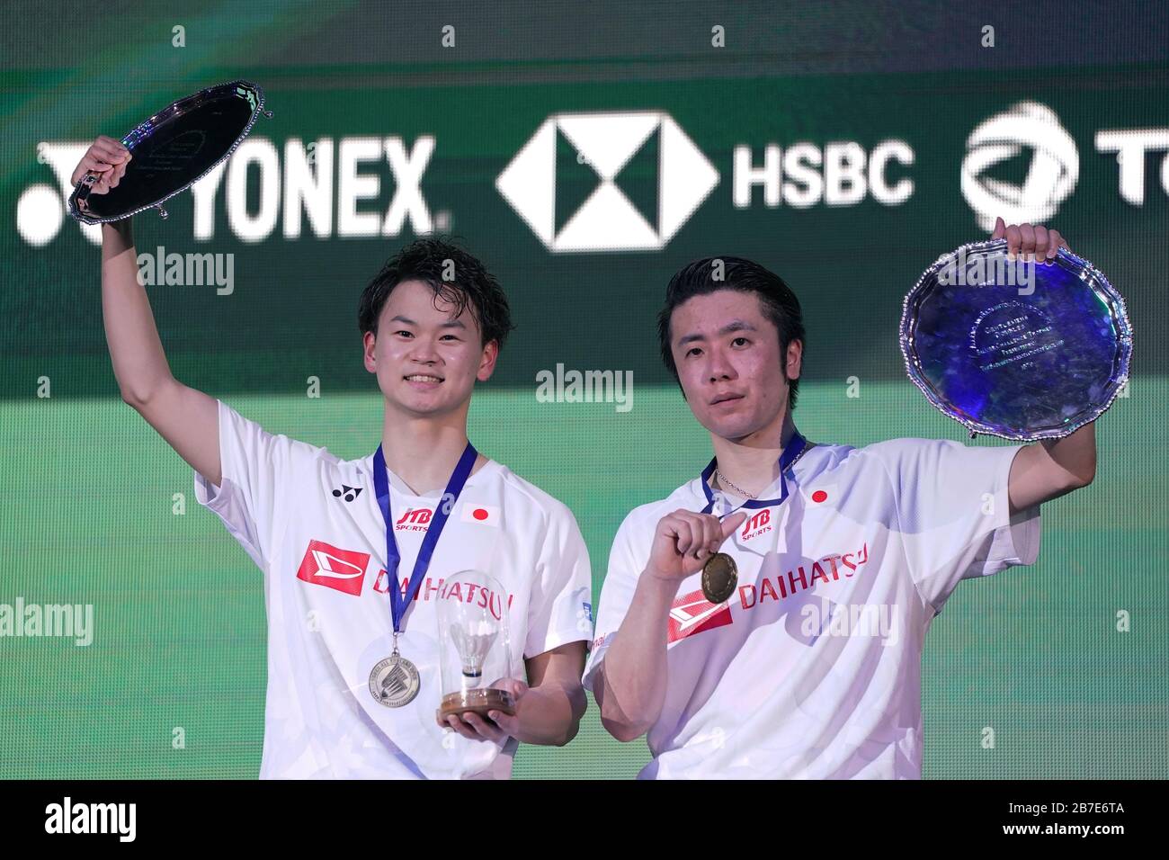 Japan's Yuta Watanabe (left) and Hiroyuki Endo with their trophies ...