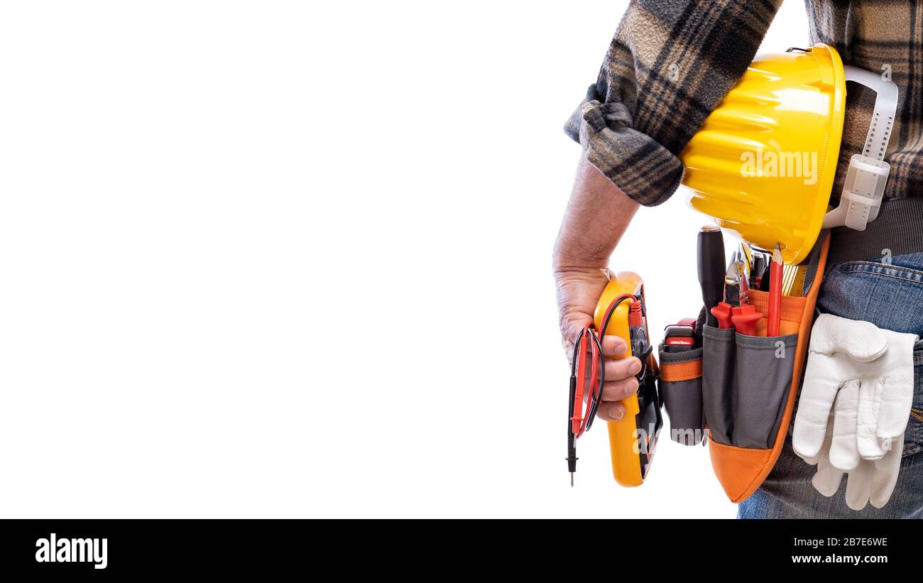 View from behind, electrician holds multimeter tester in hand, helmet ...