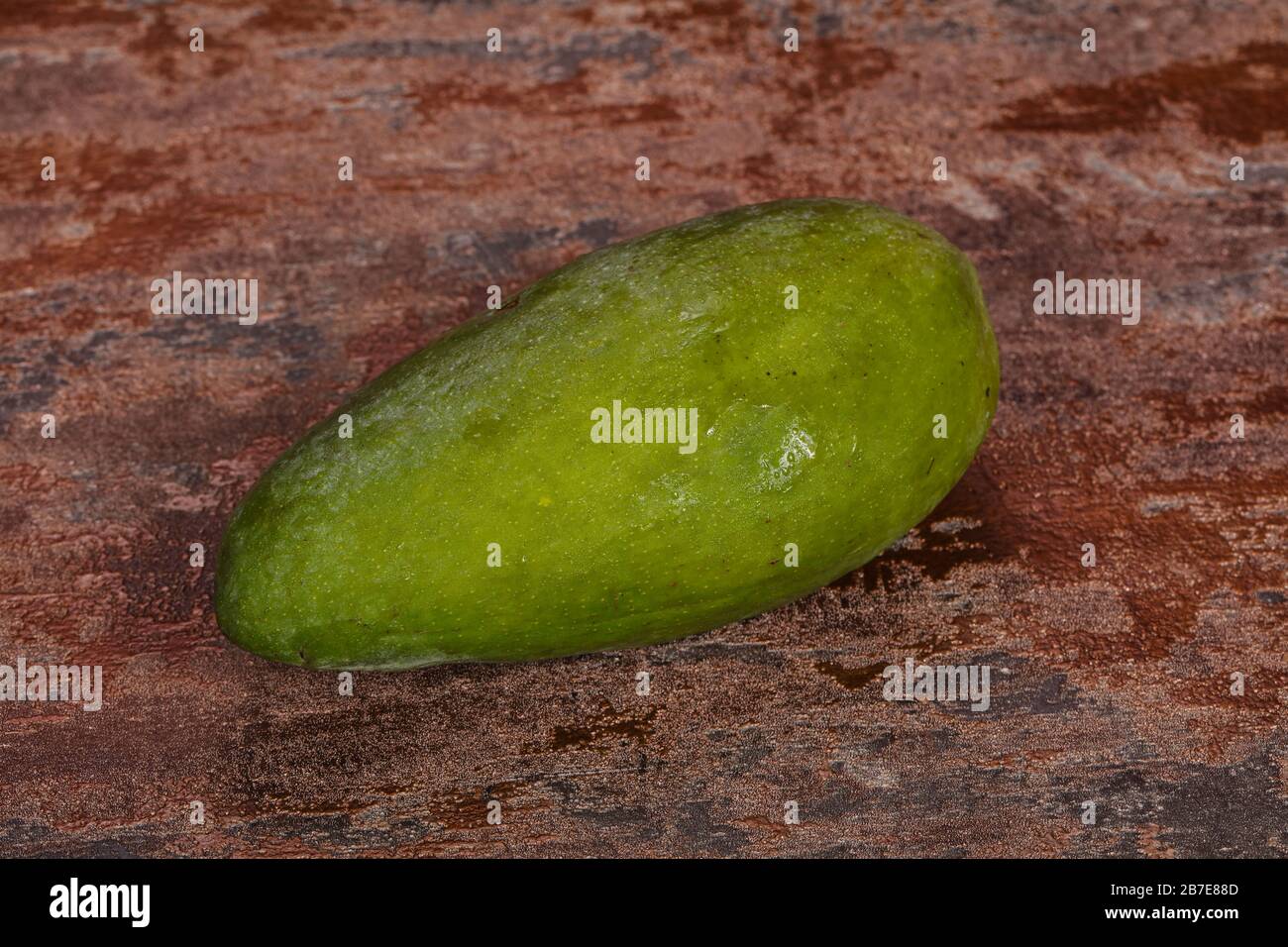 Green tasty mango over background Stock Photo - Alamy