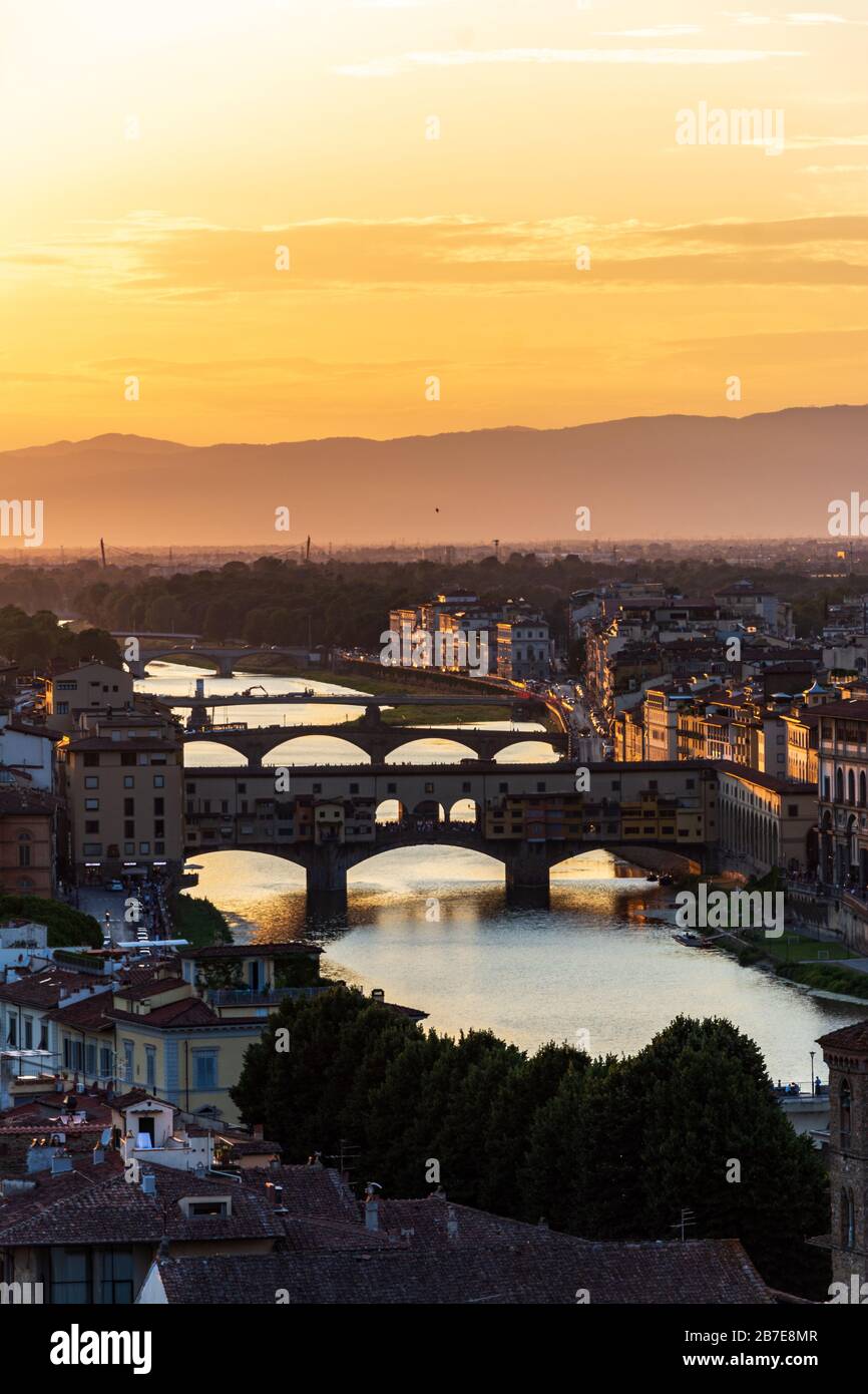 The famous bridge Ponte Vecchio in Florence over the river Arno during ...