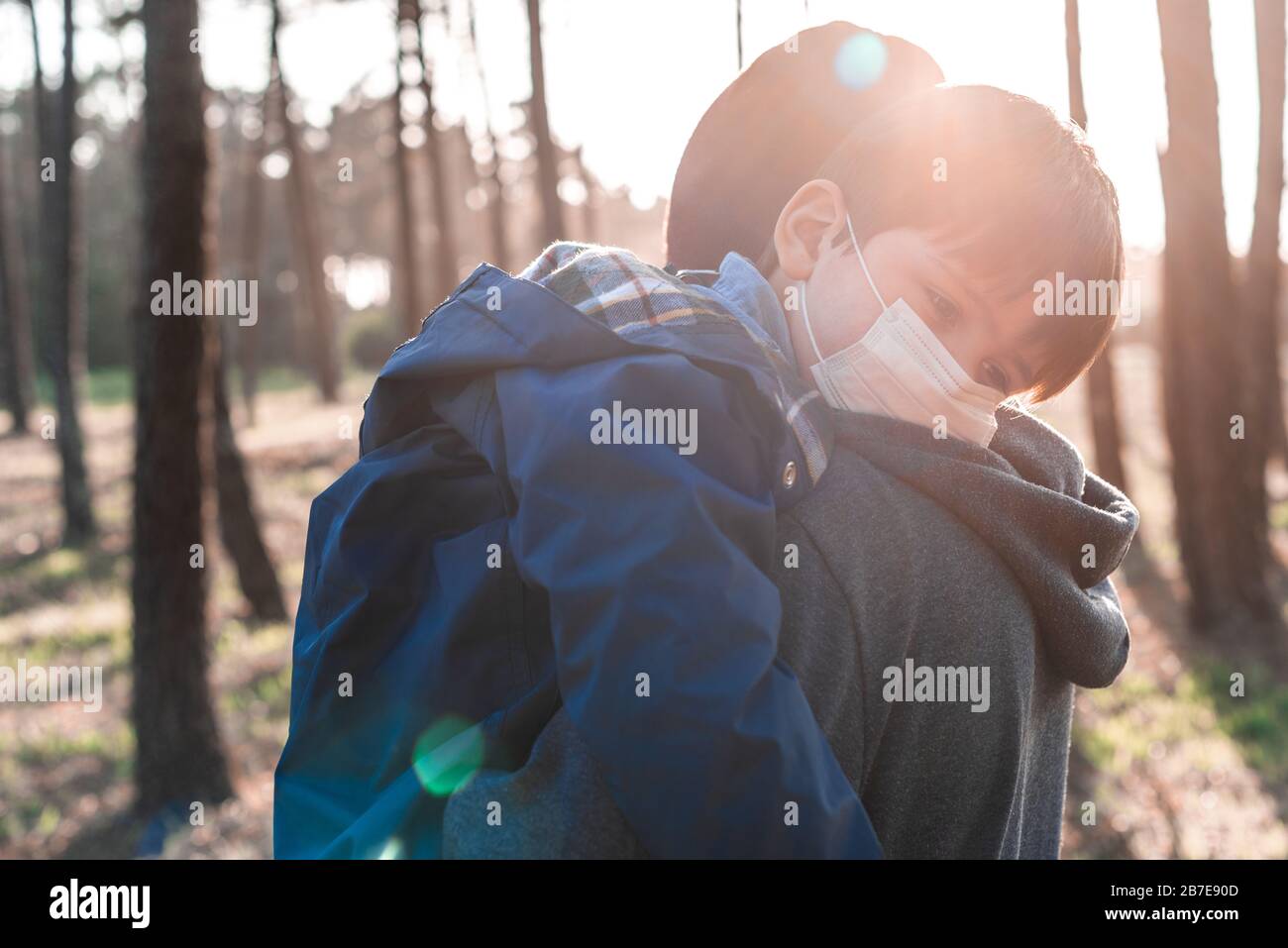 Concerned father and son using air protection masks Stock Photo - Alamy