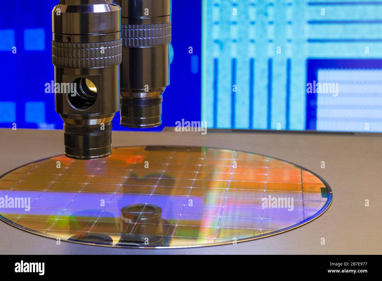 Silicon wafer with semiconductor microchip on machine process examining ...
