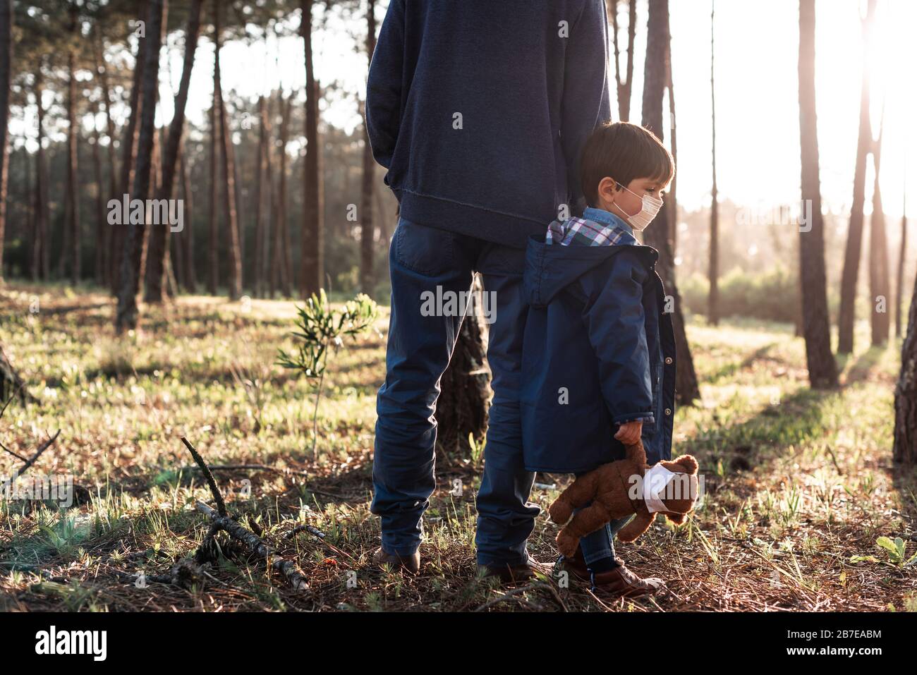 Concerned father and son using air protection masks Stock Photo - Alamy