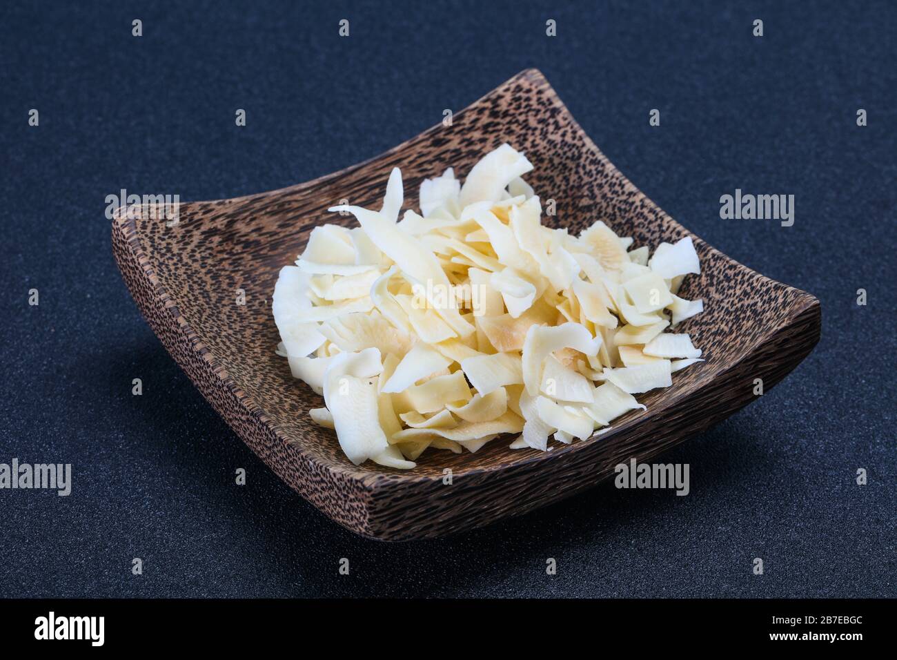 Coconut dry chips snack in the bowl Stock Photo - Alamy