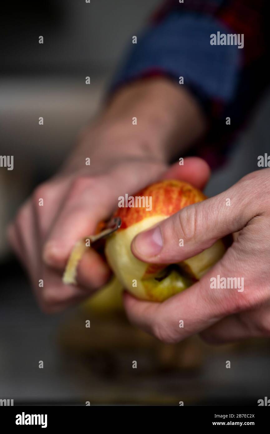 Male peeling apple hi-res stock photography and images - Alamy