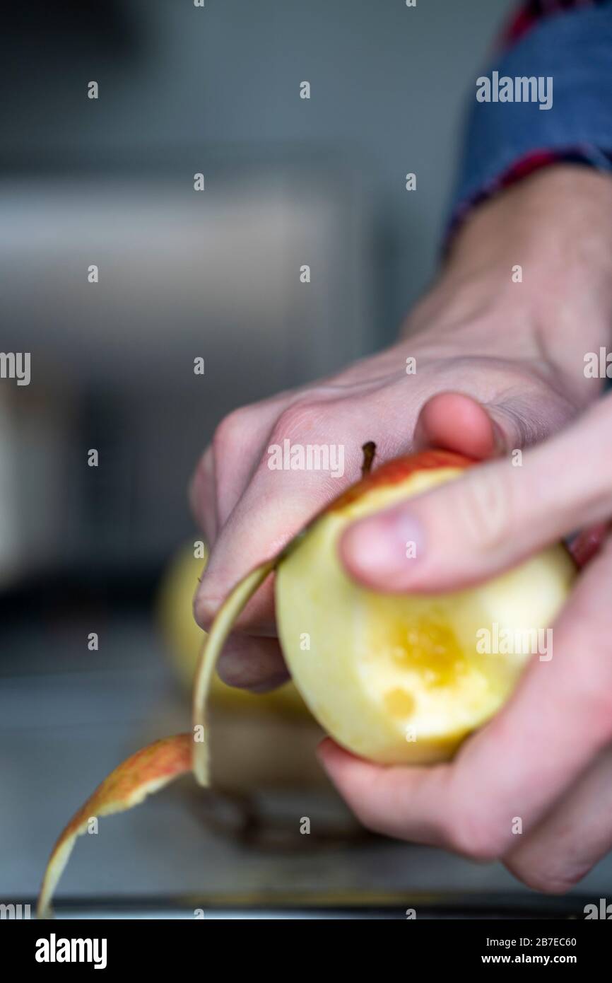 Male peeling apple hi-res stock photography and images - Alamy