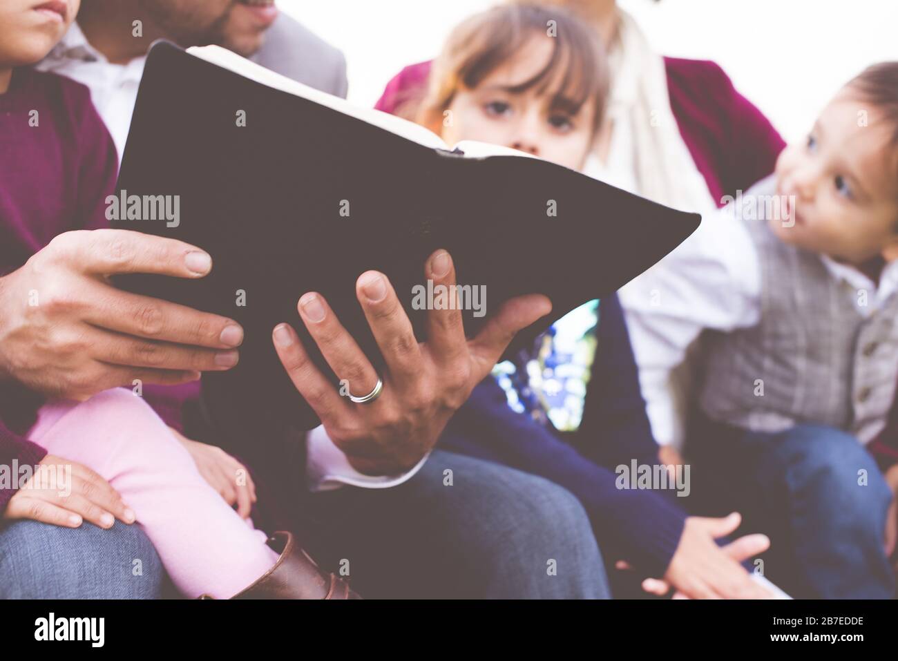 Church father reading bible hi-res stock photography and images - Alamy