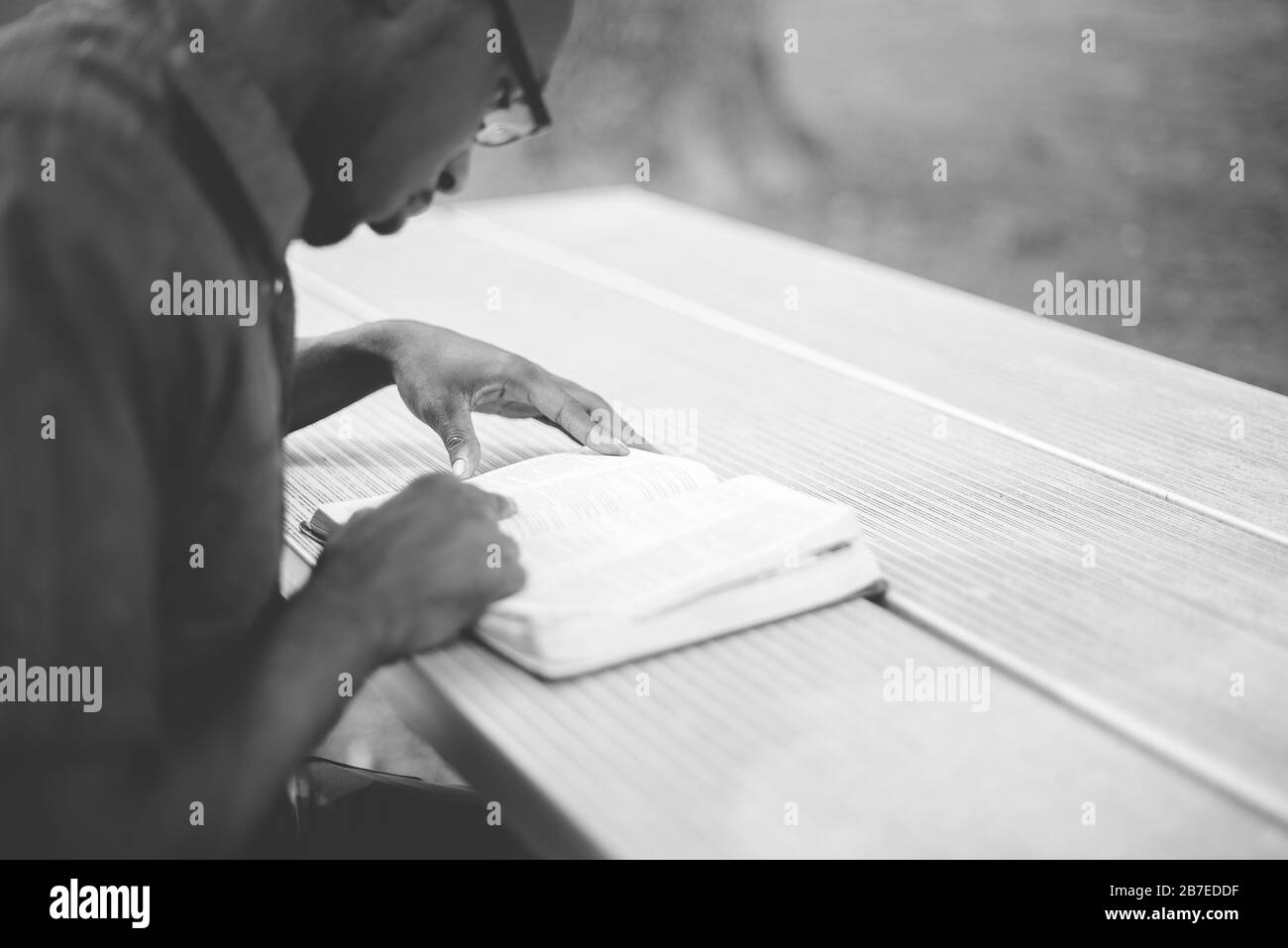 African american woman reading bible hi-res stock photography and ...