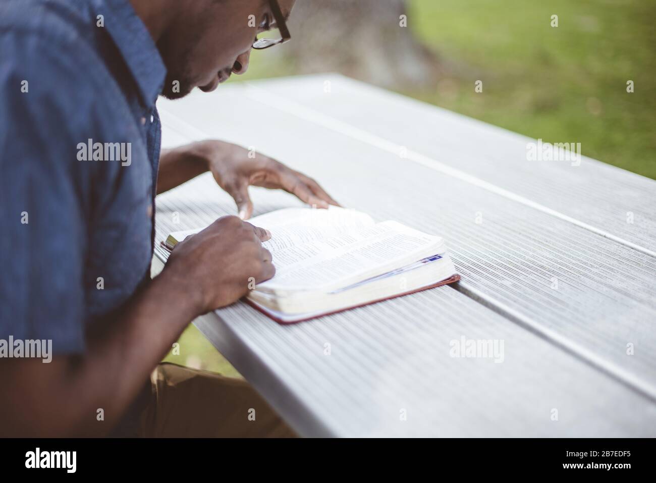 African american woman reading bible hi-res stock photography and ...