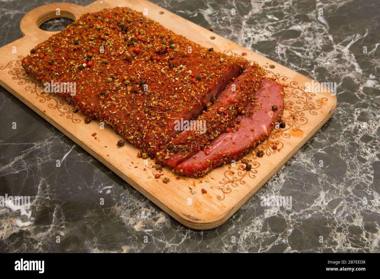 Raw meat on board Stock Photo - Alamy
