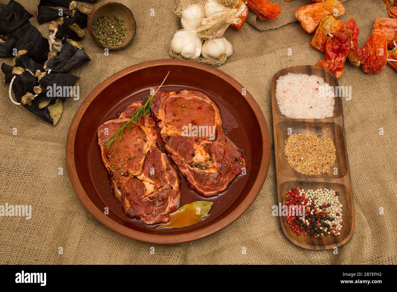 Raw meat on board Stock Photo - Alamy