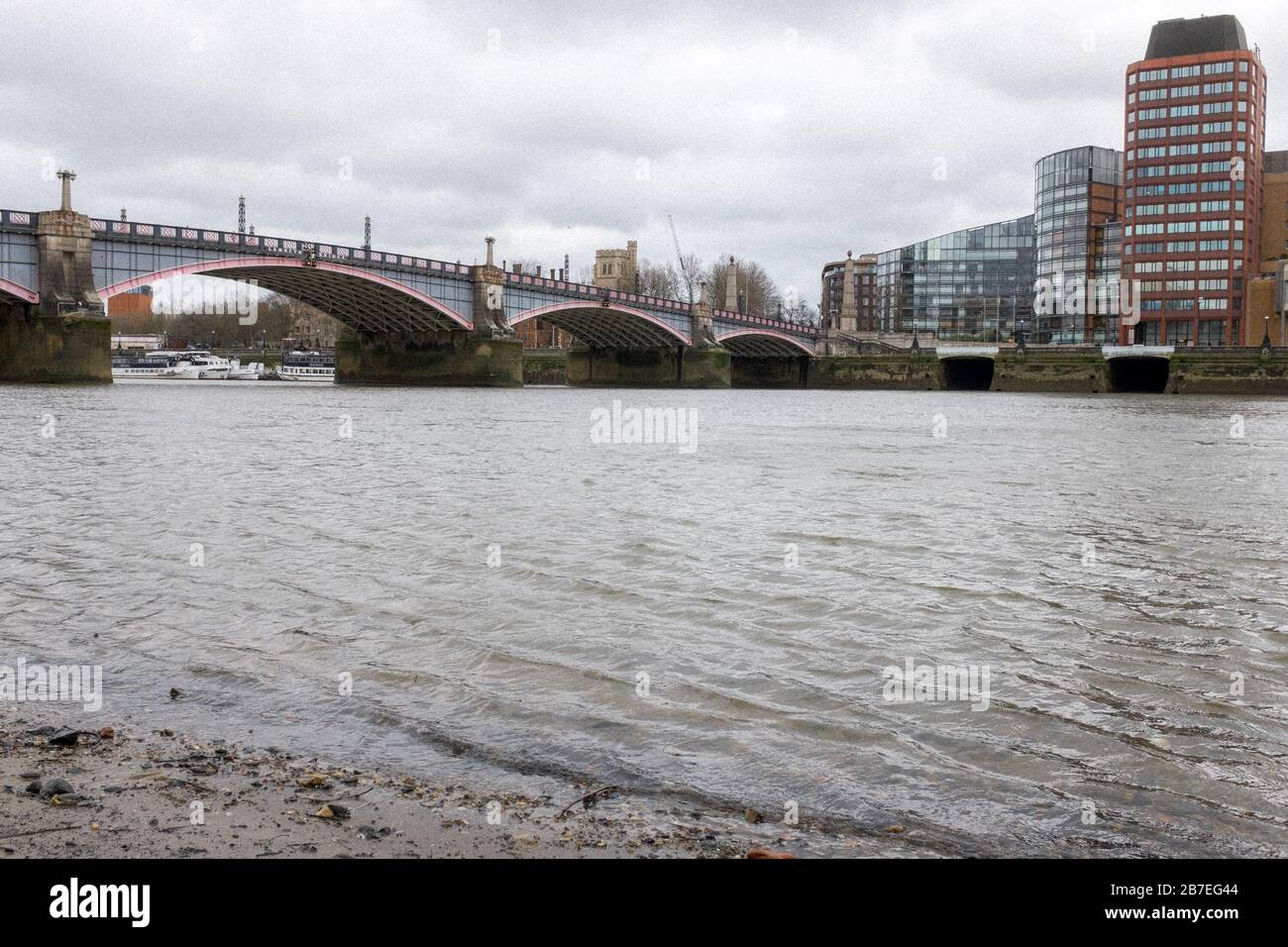 The Tide Out On The River Thames, People Walk Along The Coast ...