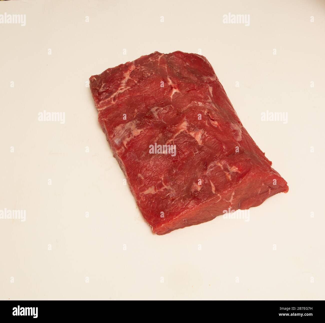Raw meat on board Stock Photo - Alamy