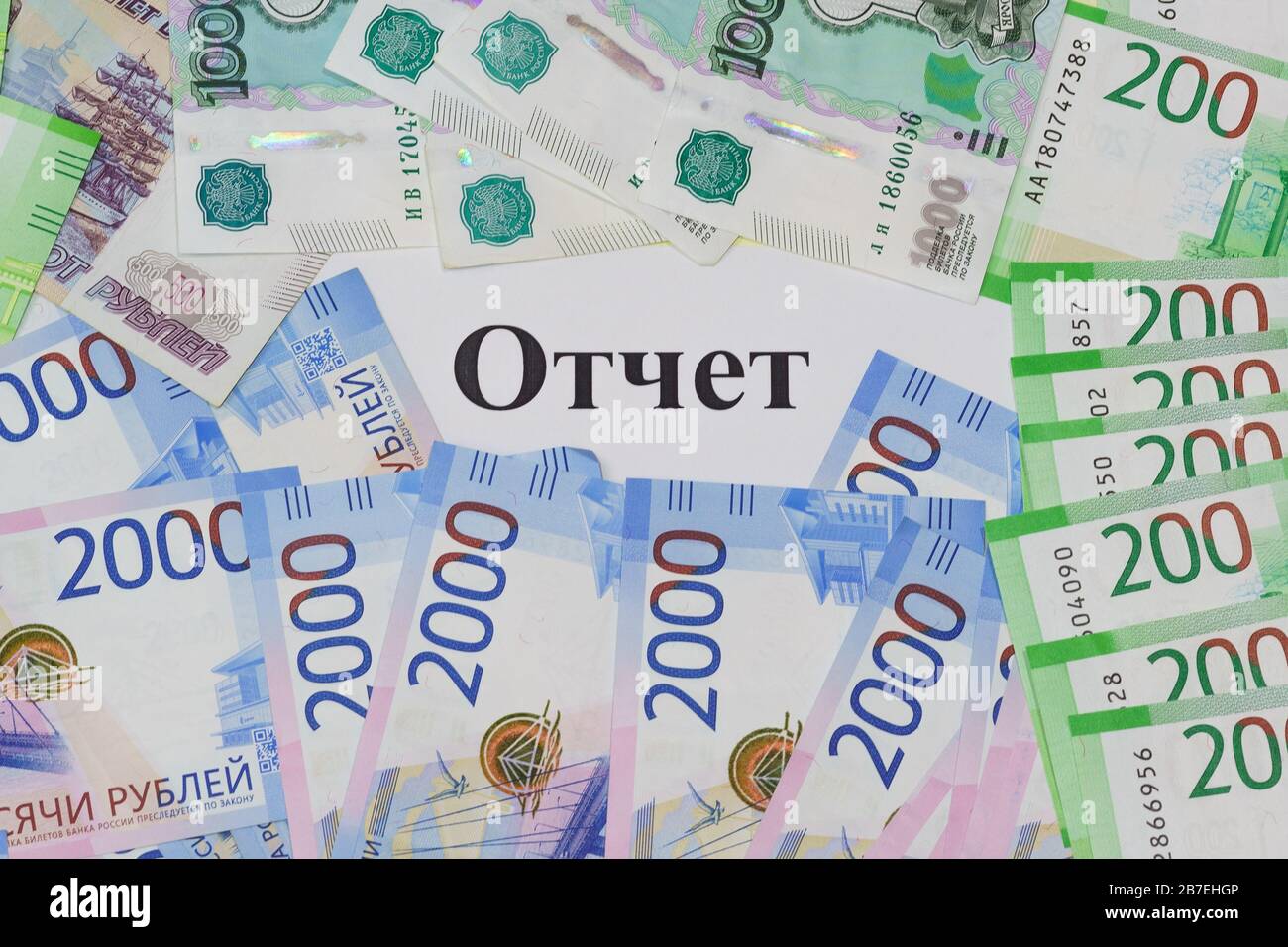 The inscription in Russian Report and new Russian banknotes around ...