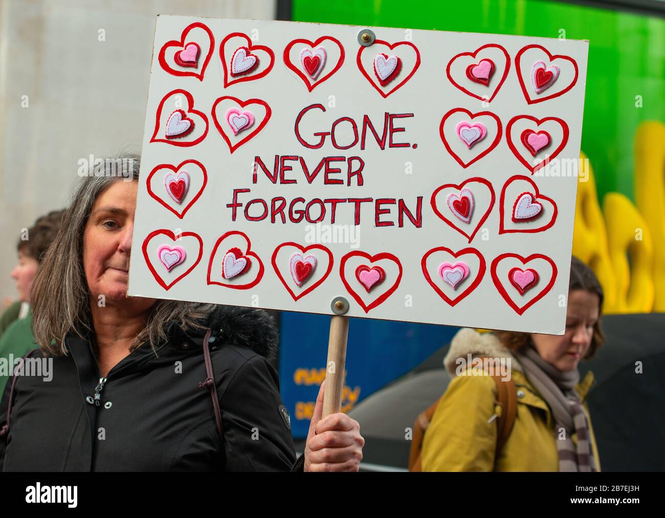 Female protester with banner at the Million Women Rise demonstration in ...
