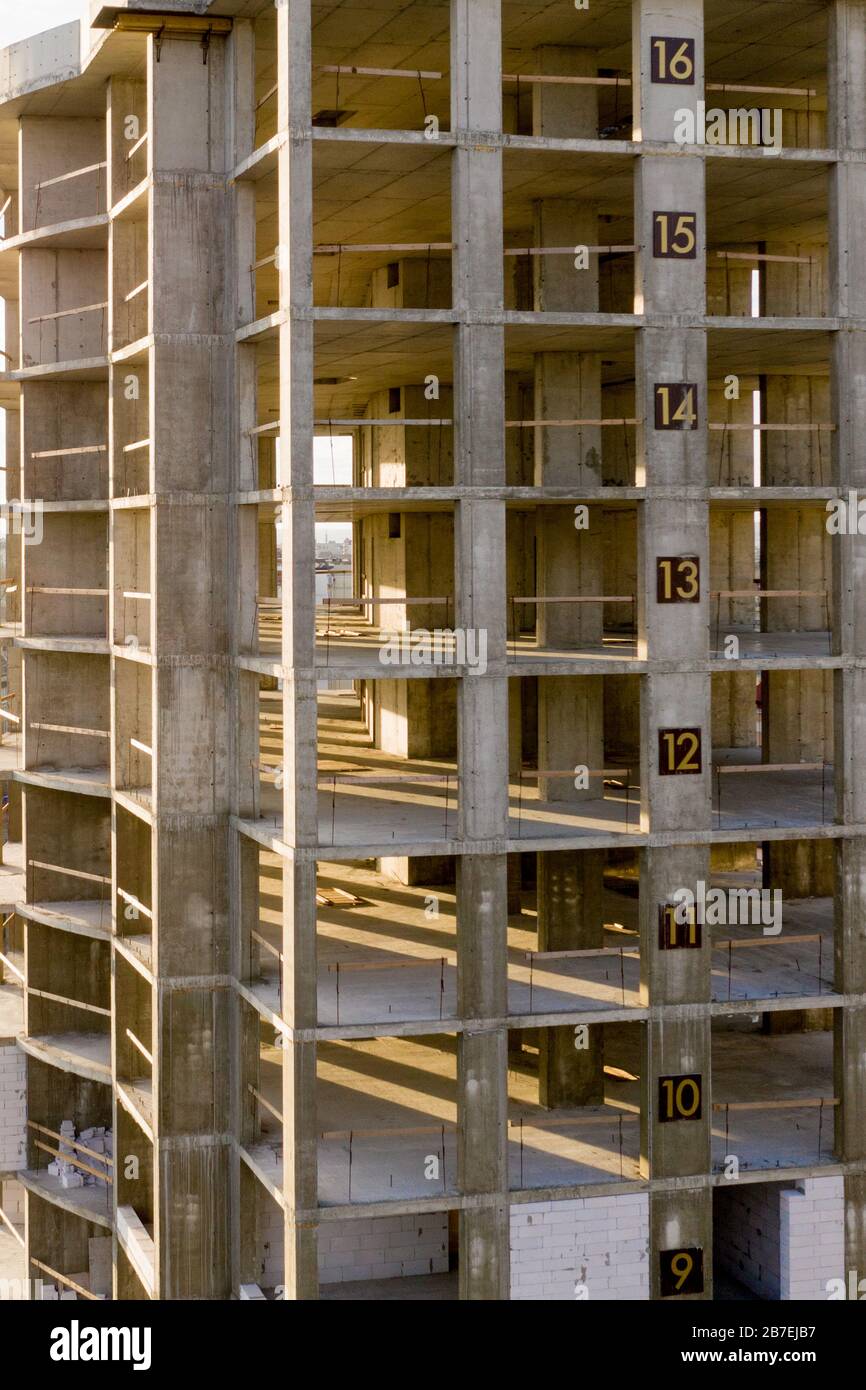 Aerial view of concrete frame of tall apartment building under ...