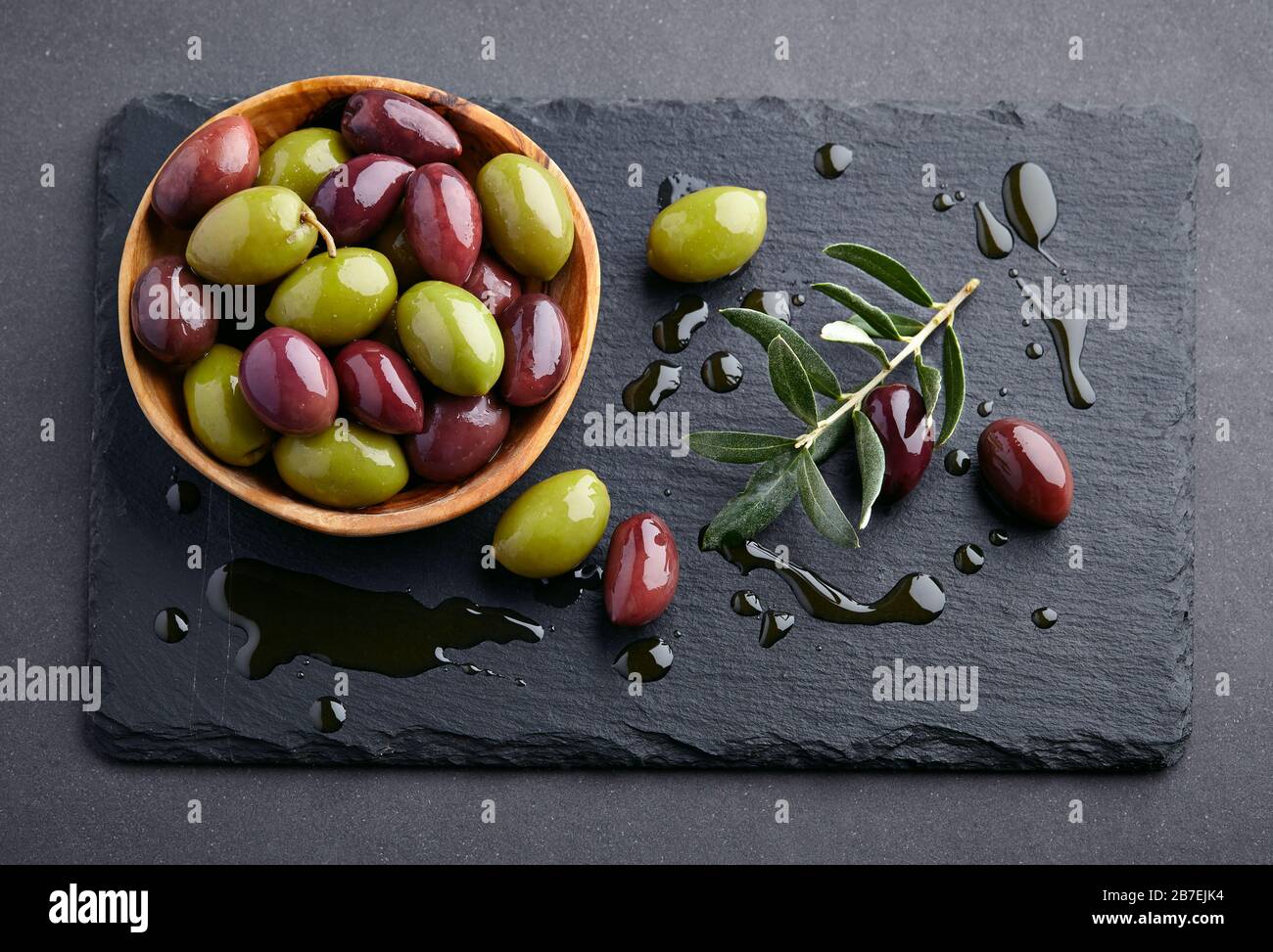 Olives on a graphite board Stock Photo - Alamy