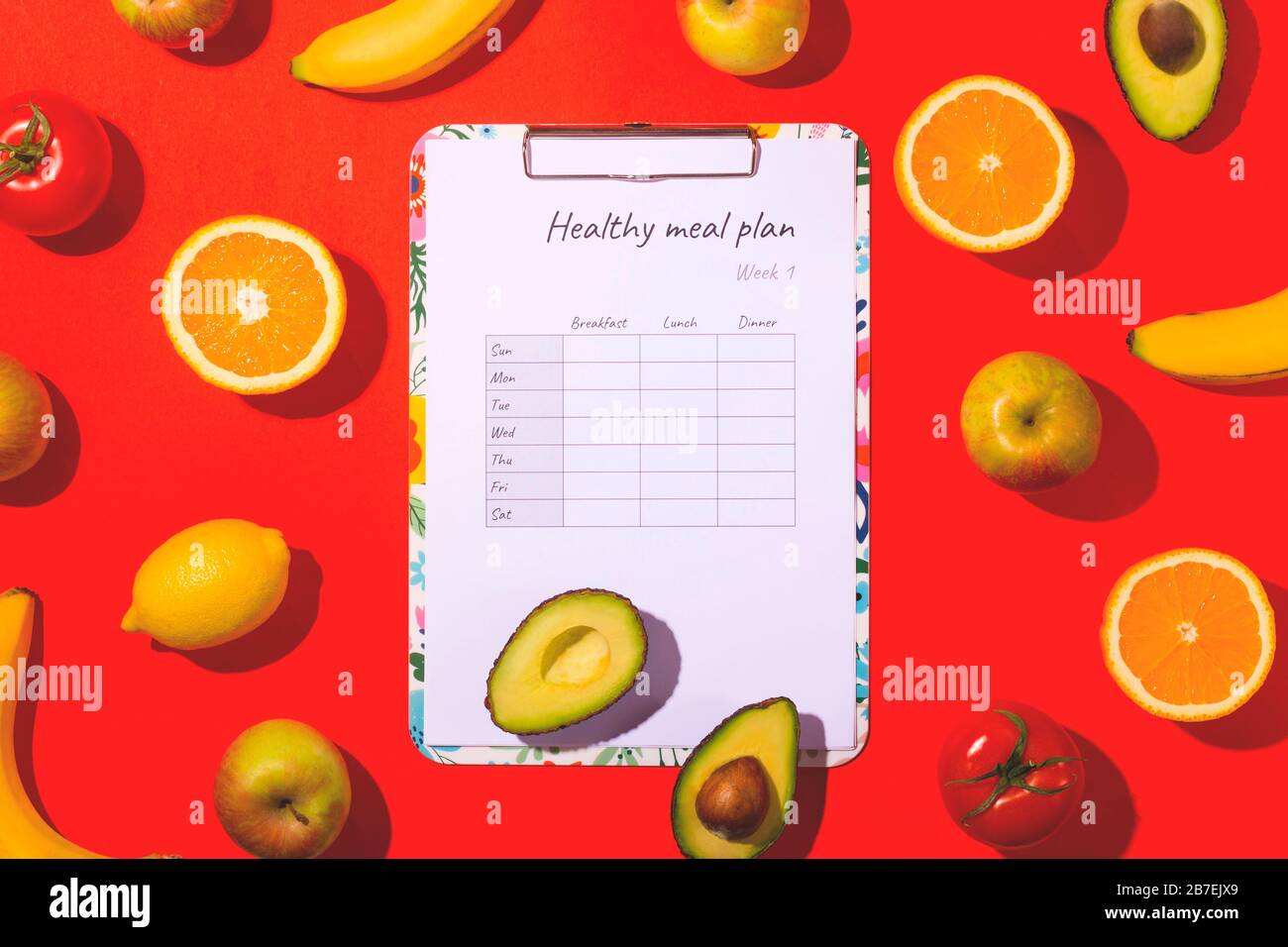 Healthy weekly meal plan among fresh organic fruits and vegetables ...