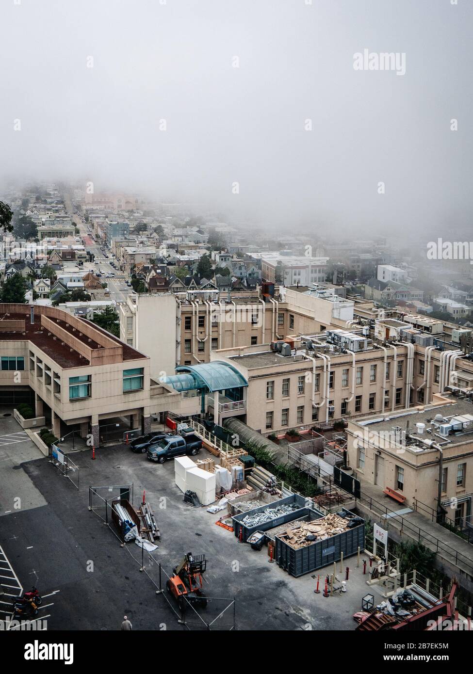 Aerial shot of city buildings under a thick cloud Stock Photo - Alamy