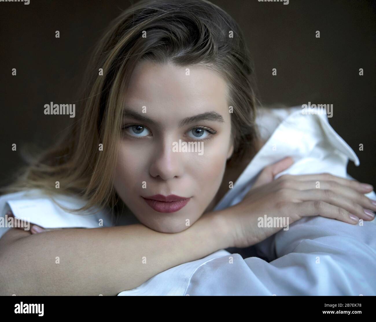Beauty blond model sitting down hi-res stock photography and images - Alamy