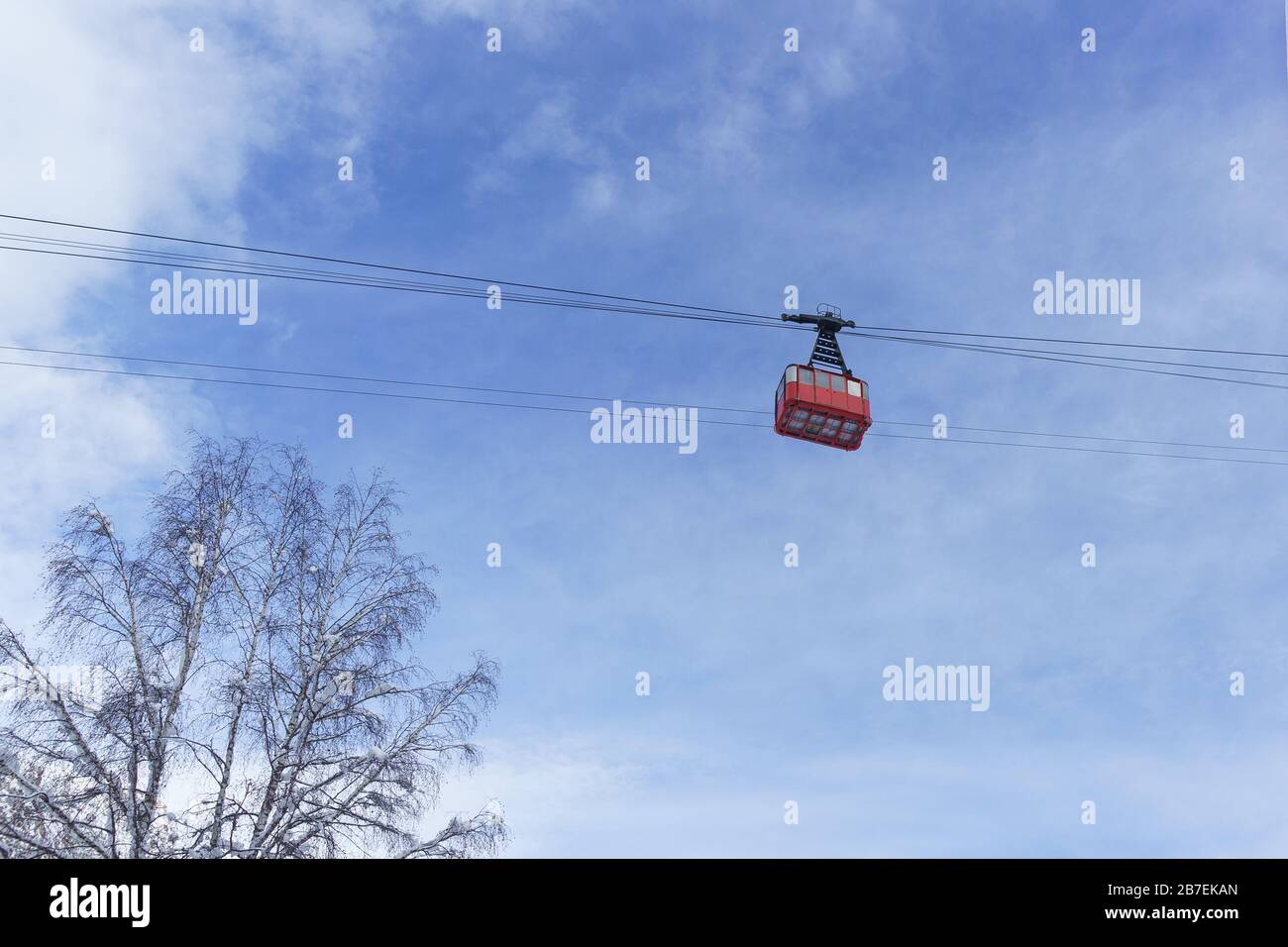 Old red cable car on a background of blue sky. A cold winter day Stock ...