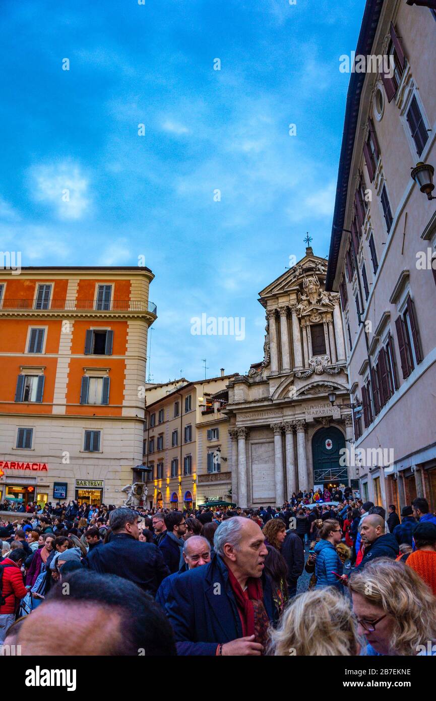 Crowds of tourists gather in front of Trevi Fountain, one of the city's ...