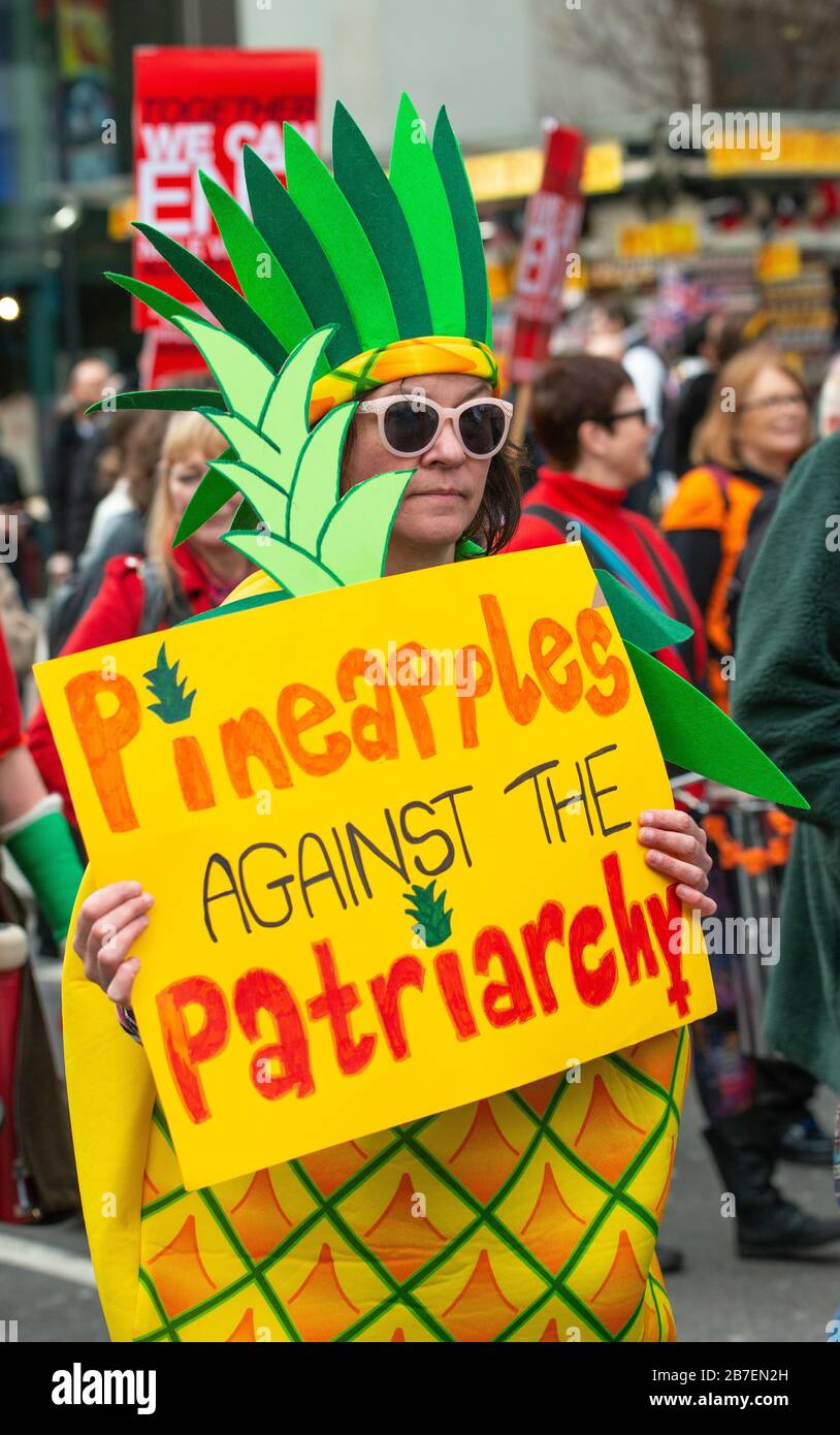 Female protester with banner at the Million Women Rise demonstration in ...