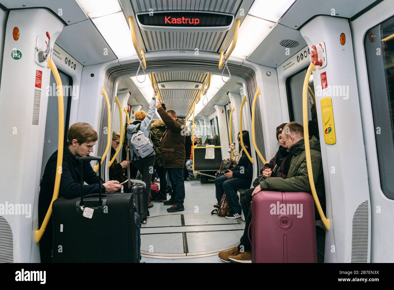 Interior view of Copenhagen driverless metro train with passengers ...