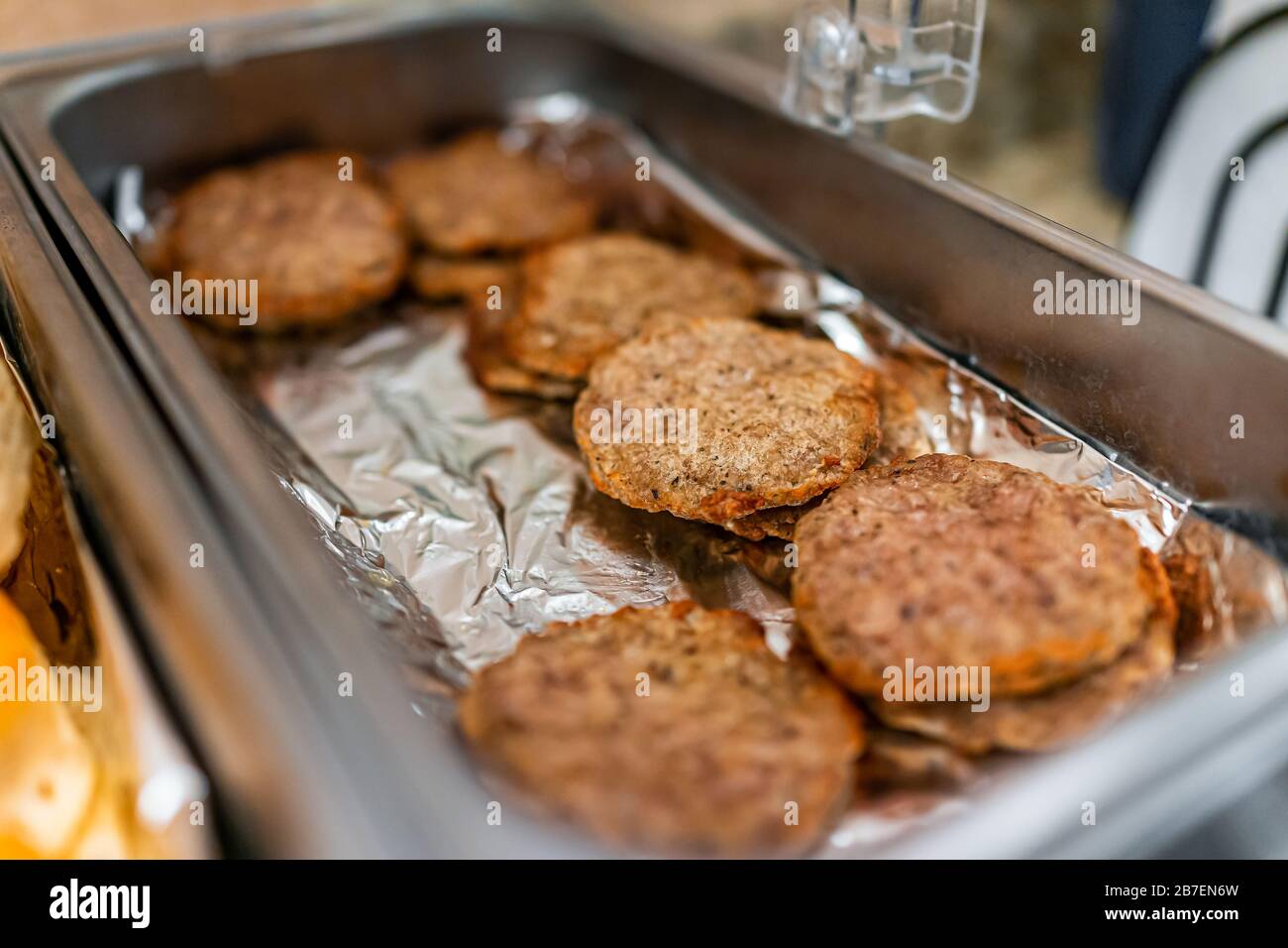Fresh buffet tray macro closeup with food sausage patties in banquet ...
