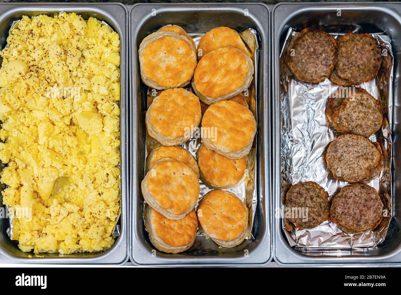 Fresh hot buffet tray flat top view of food scrambled eggs, biscuits ...