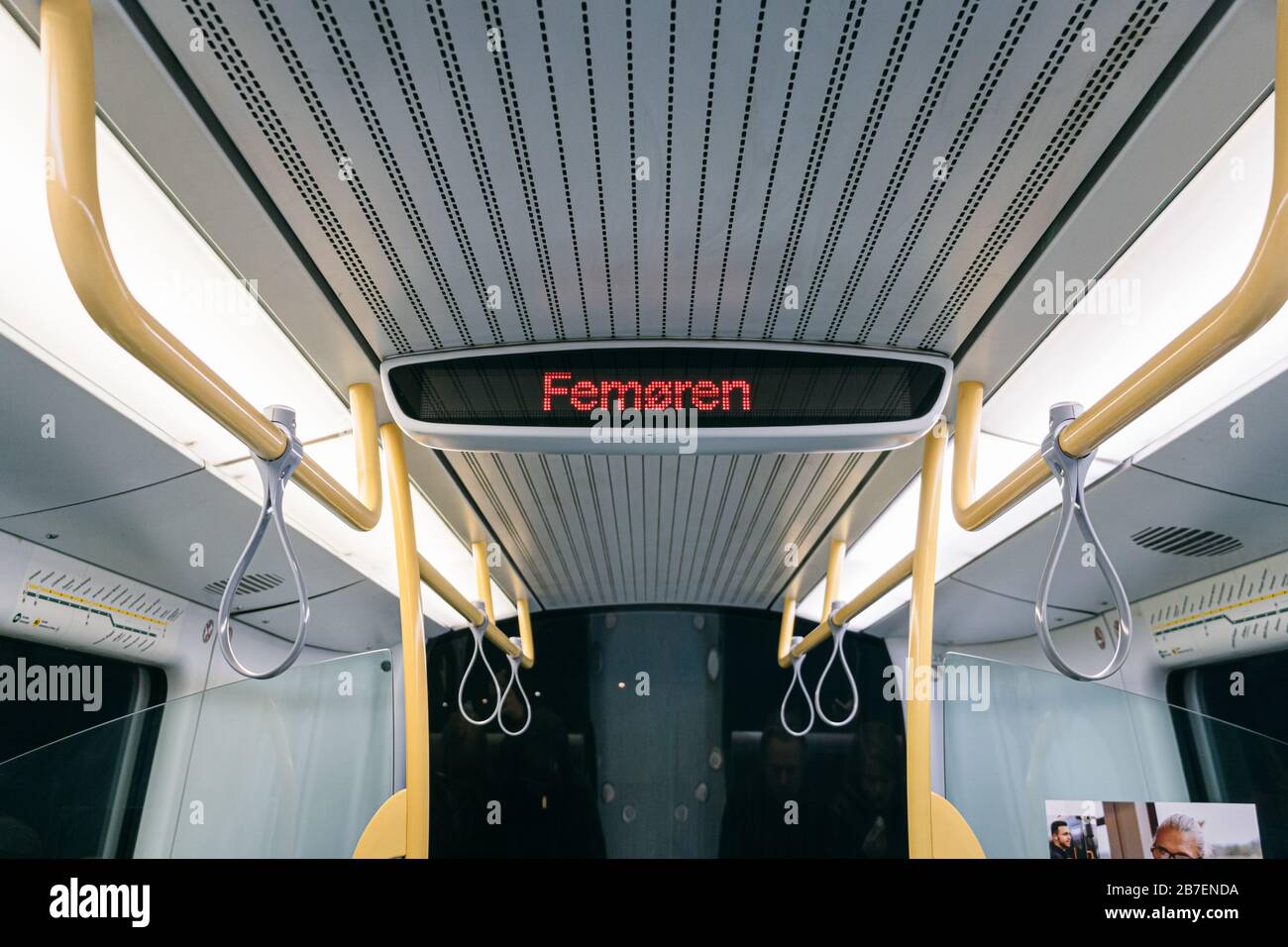 Interior view of Copenhagen driverless metro train with passengers ...