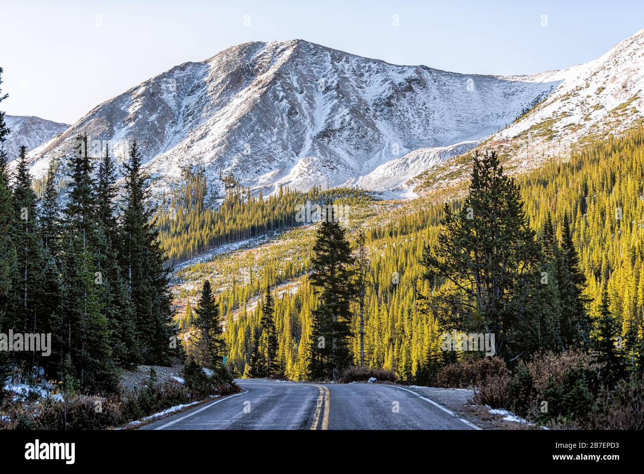 Independence Pass snow rocky mountain view and paved road scenic byway ...