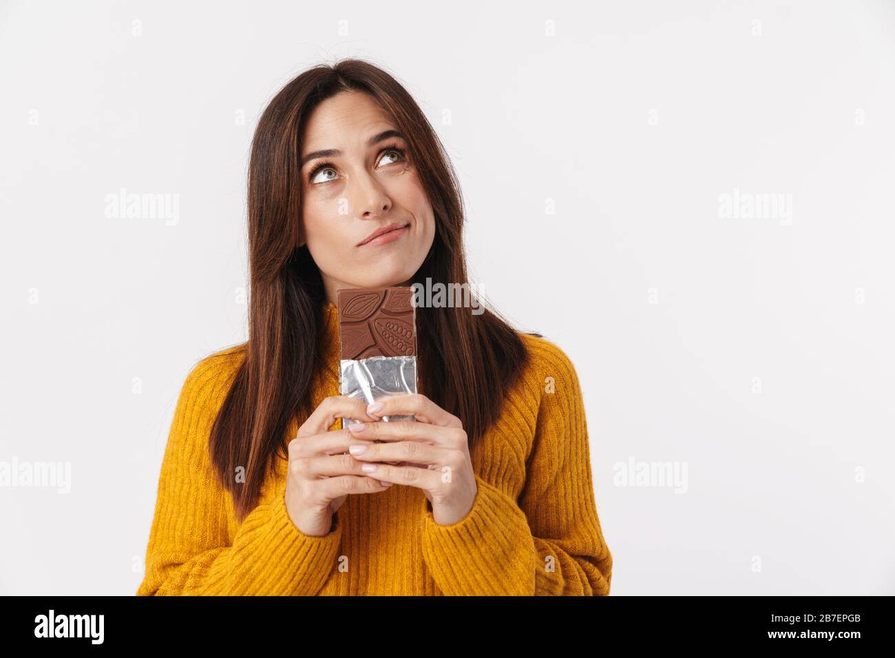 Image of beautiful brunette adult woman hesitating while holding ...