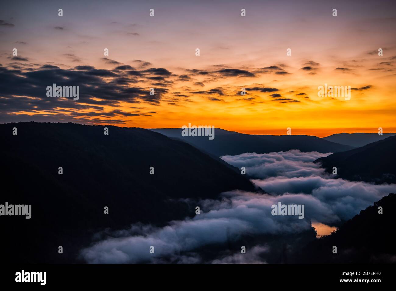 Mountains landscape clouds fog mist in morning above new river gorge ...